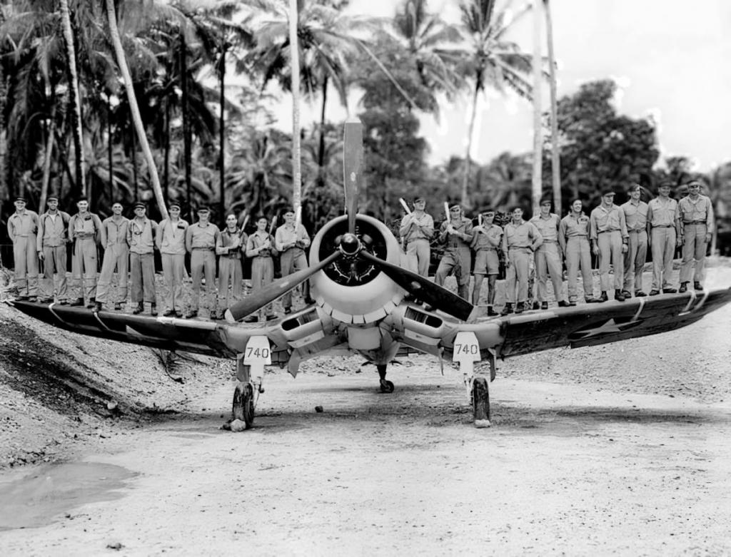 The Black Sheep Squadron pose on the wings of Corsair aircraft at Vella ...